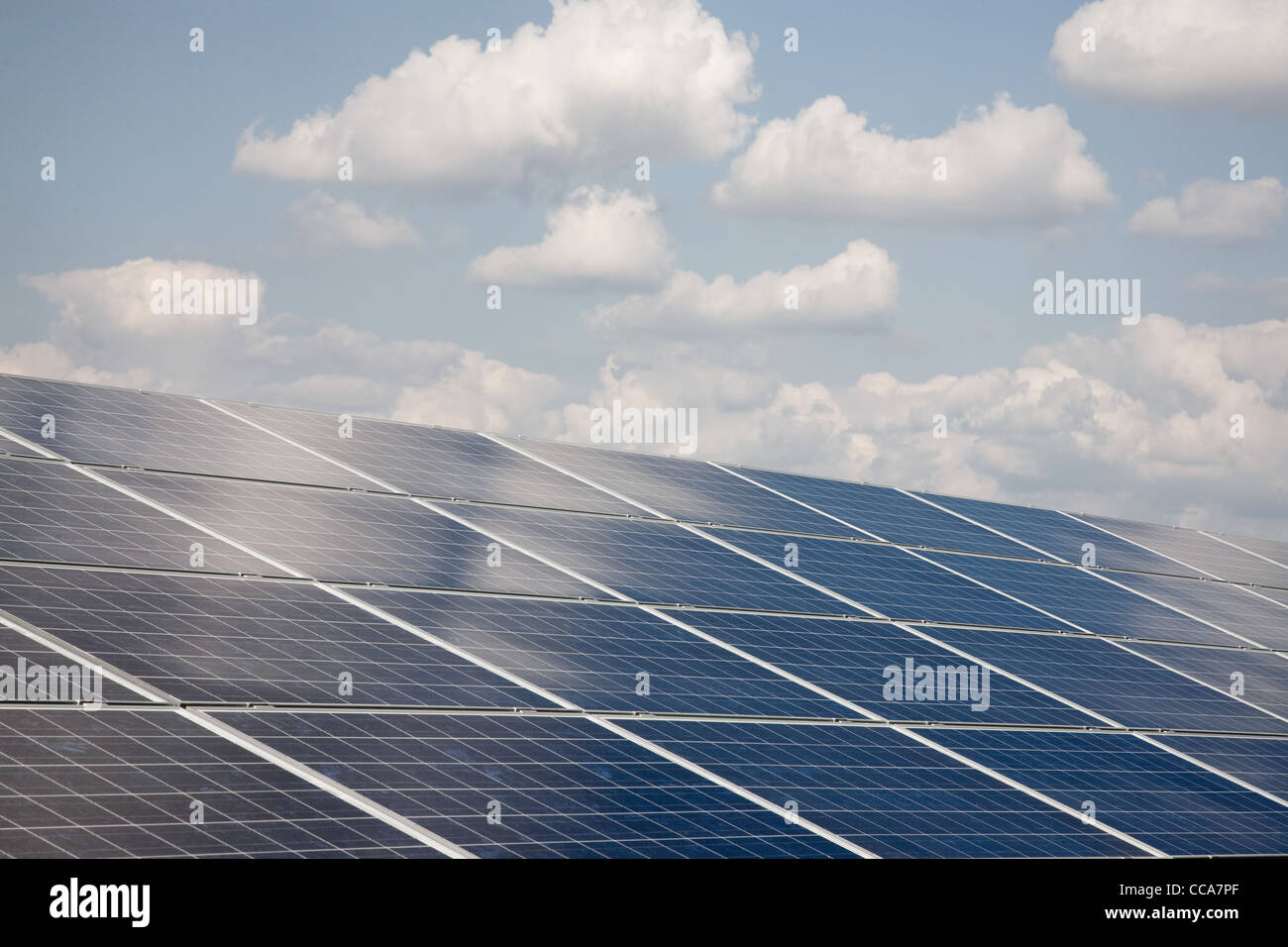Line of solar power plant panels and clouds Stock Photo - Alamy