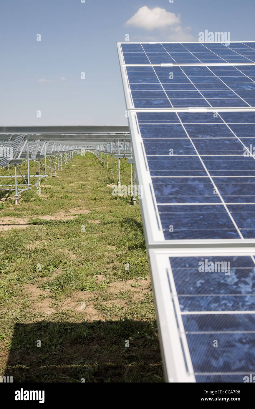 Line of solar power plant panels and clouds Stock Photo - Alamy
