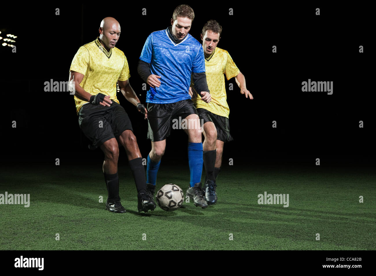 Soccer players tackling hi-res stock photography and images - Alamy