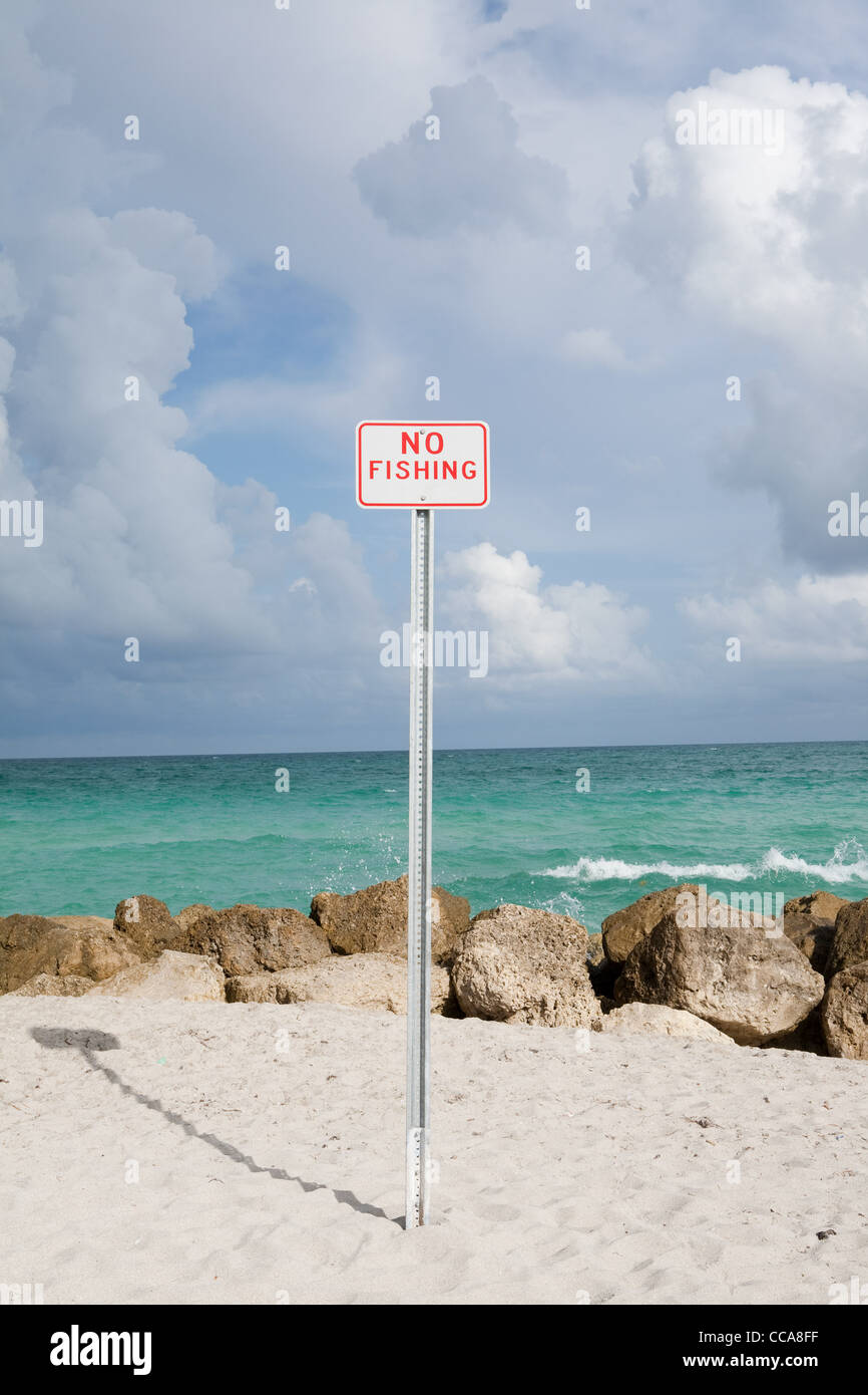 No Fishing sign at beach Stock Photo - Alamy