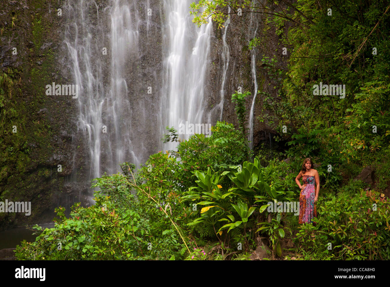 A visitor at Wailua Falls, near Hana, Maui, Hawaii. (model released ...