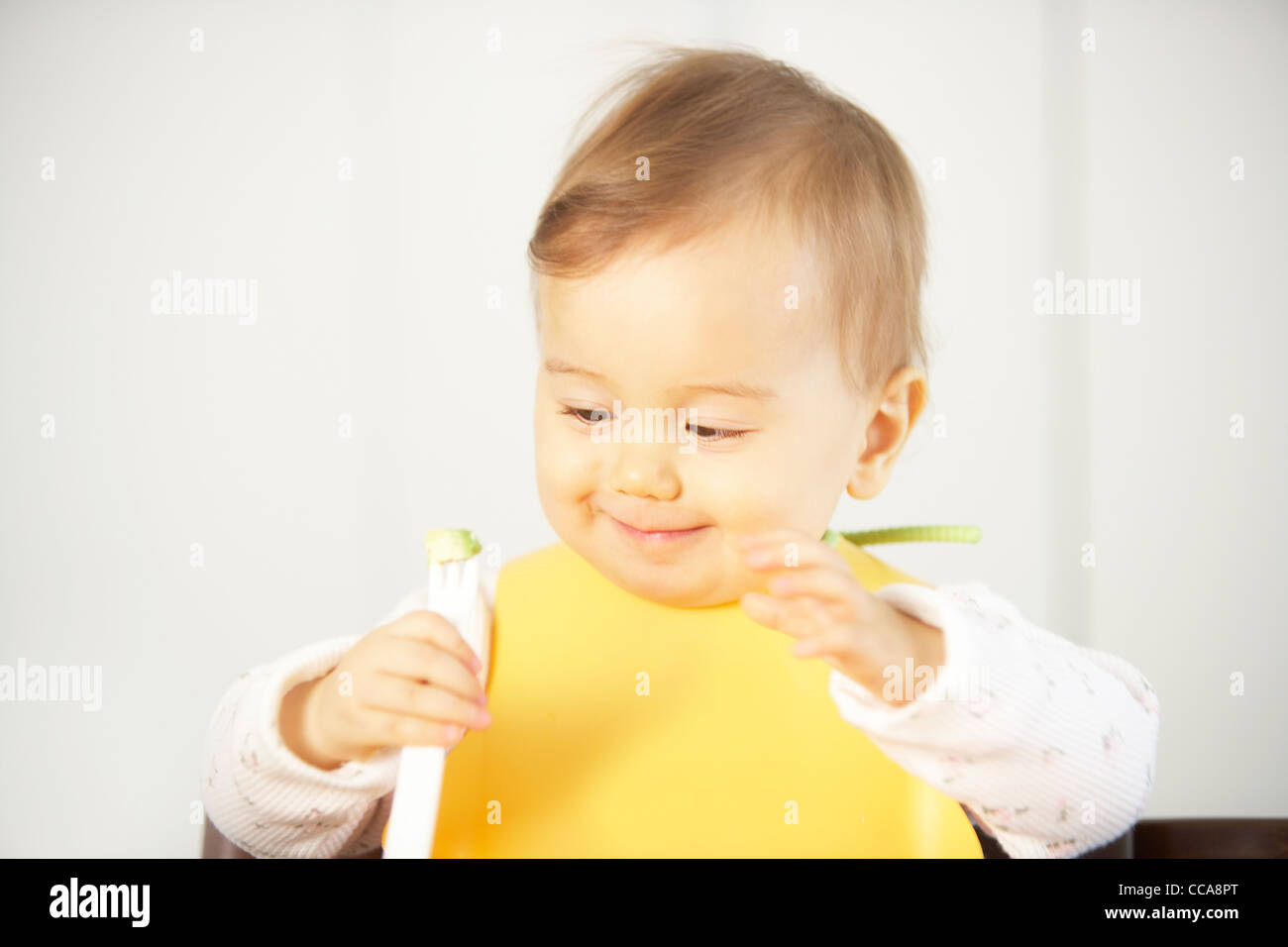 Baby Girl Eating Stock Photo - Alamy