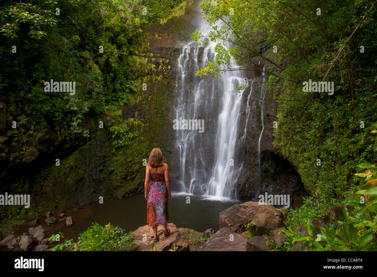 A visitor at Wailua Falls, near Hana, Maui, Hawaii. (model released ...