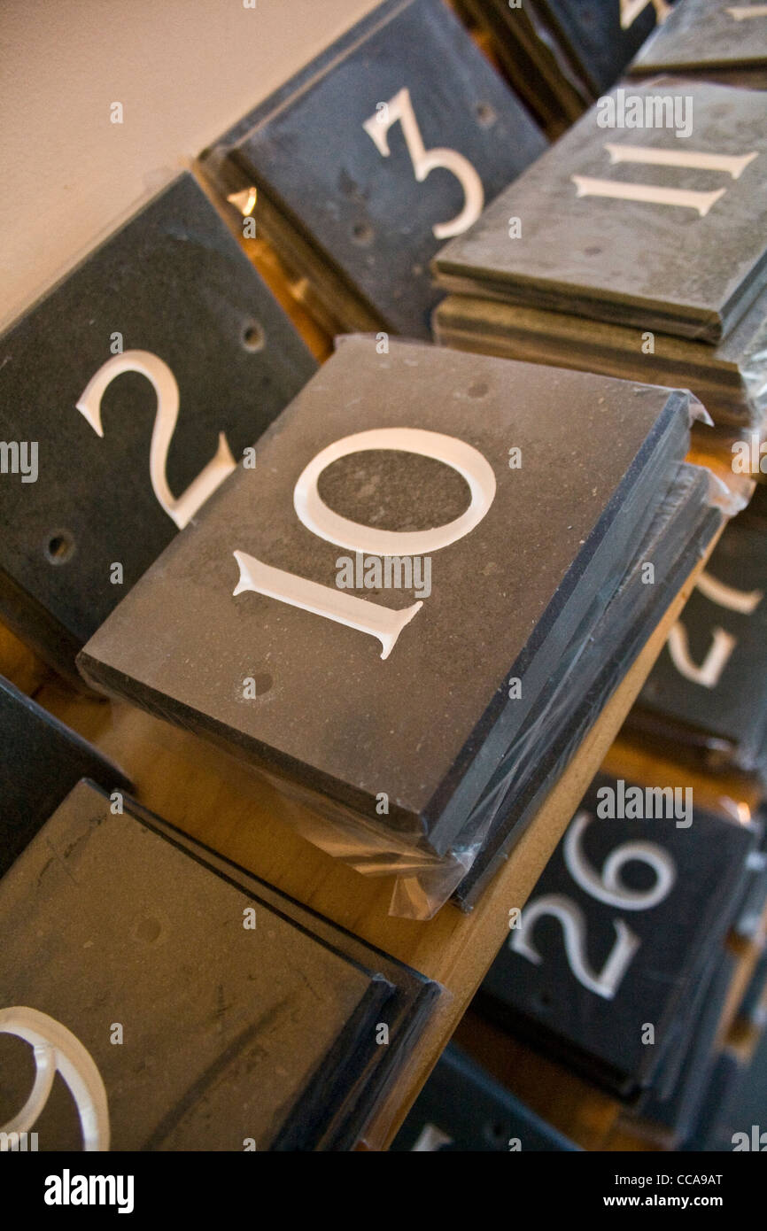 A Selection of house numbers engraved in slate Stock Photo - Alamy