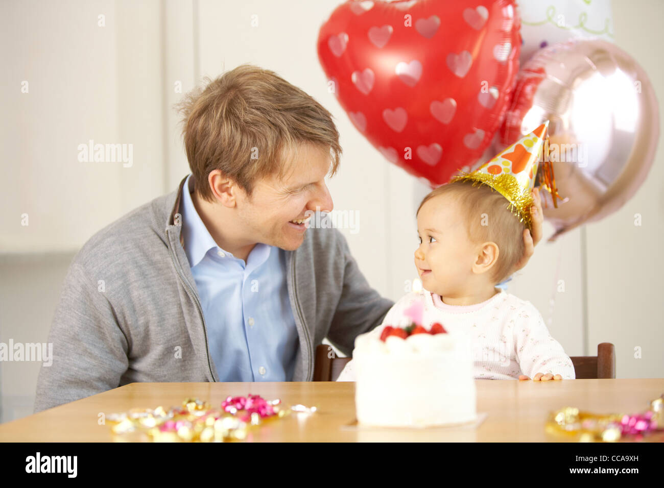 Father Celebrating Baby Girl's Birthday Stock Photo - Alamy