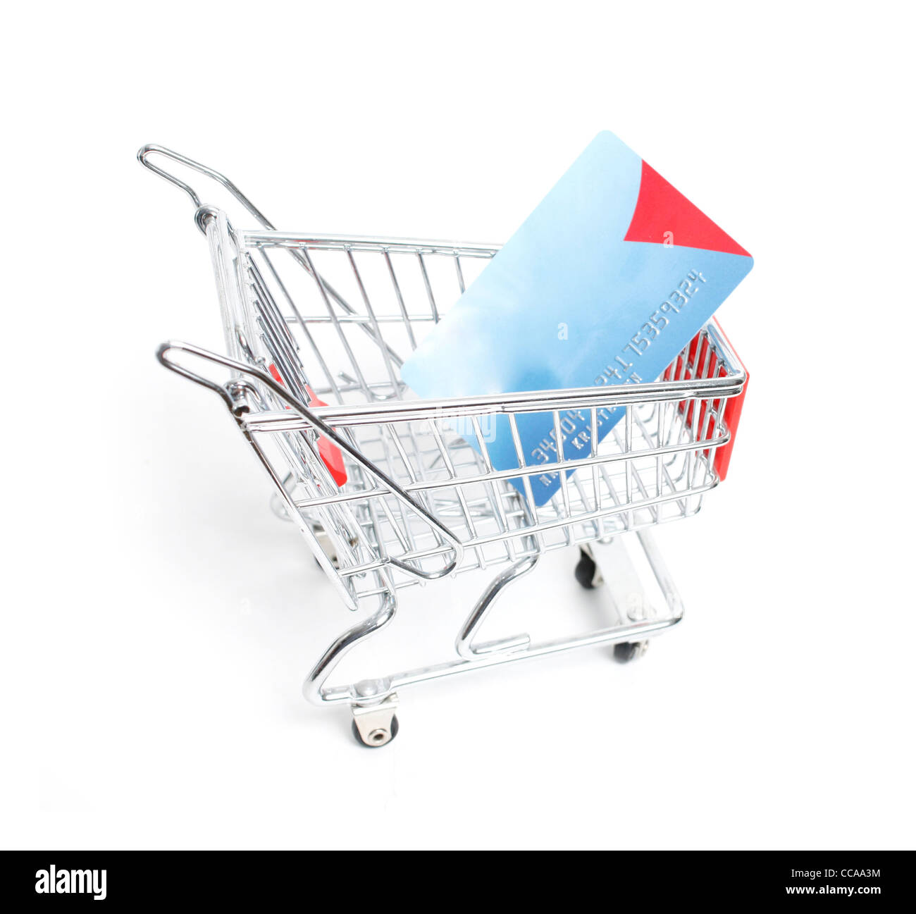 A miniature shopping trolley in studio Stock Photo - Alamy