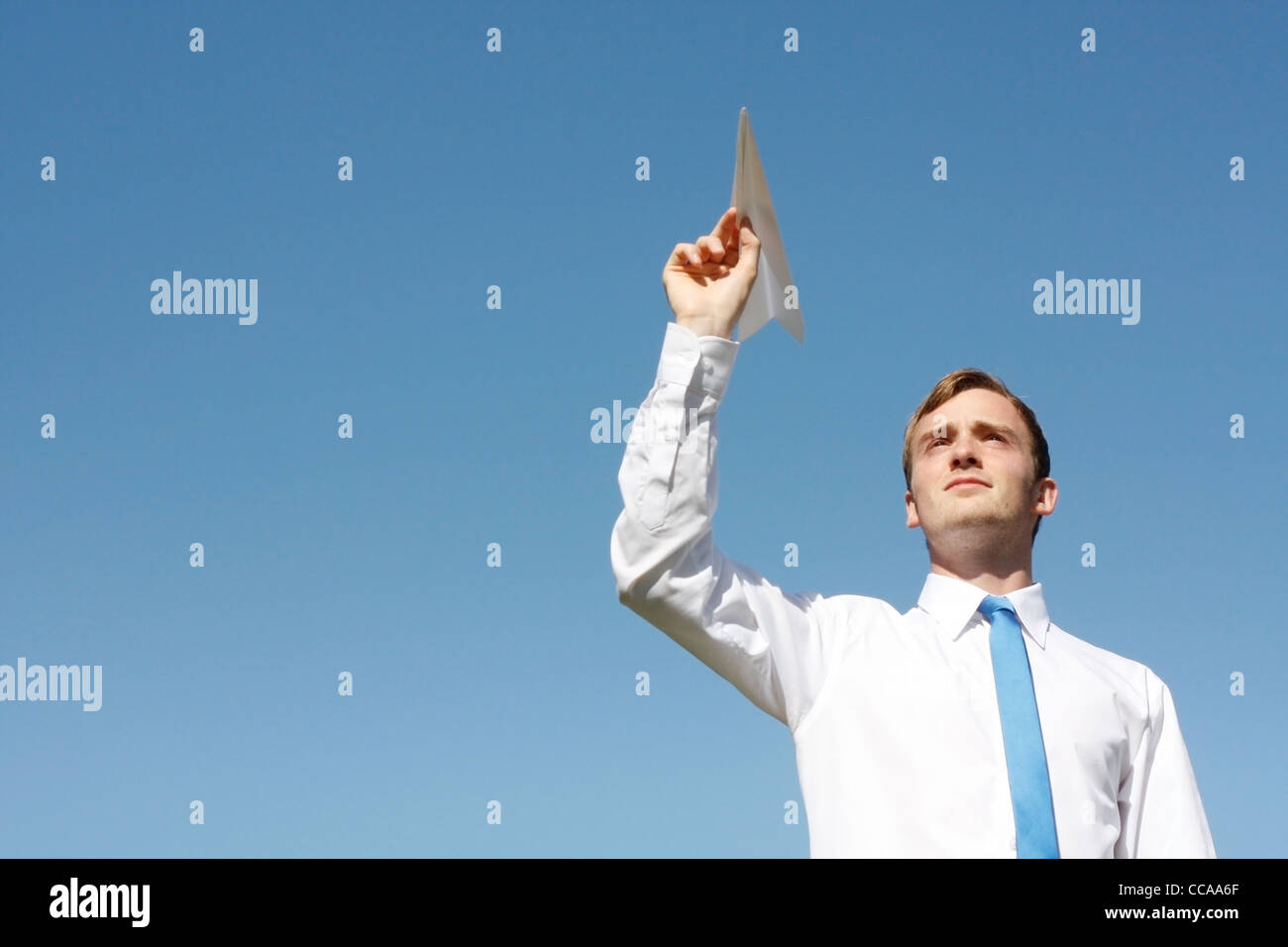 A business man throwing a paper plane Stock Photo - Alamy