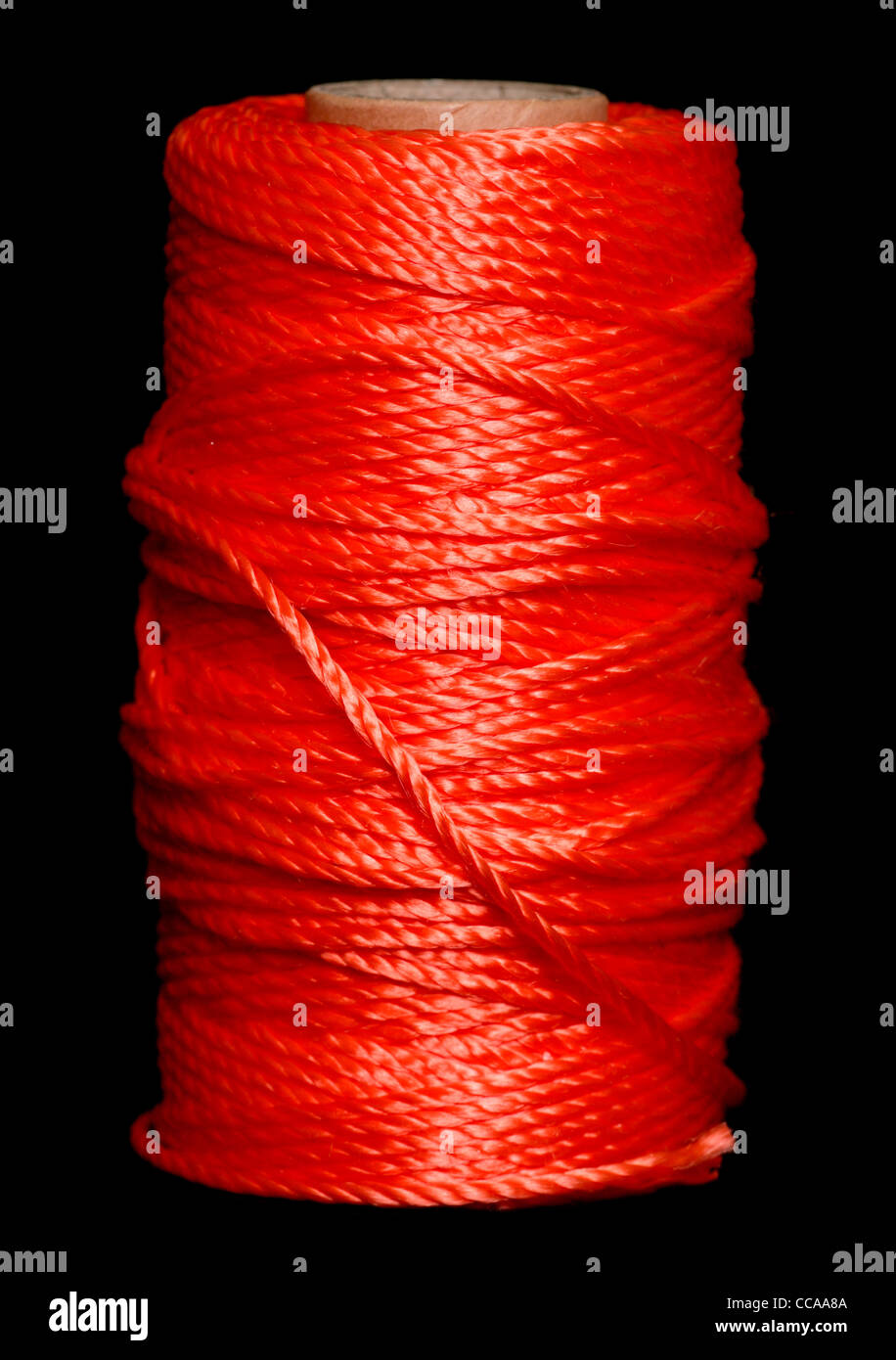 orange string on black background Stock Photo - Alamy