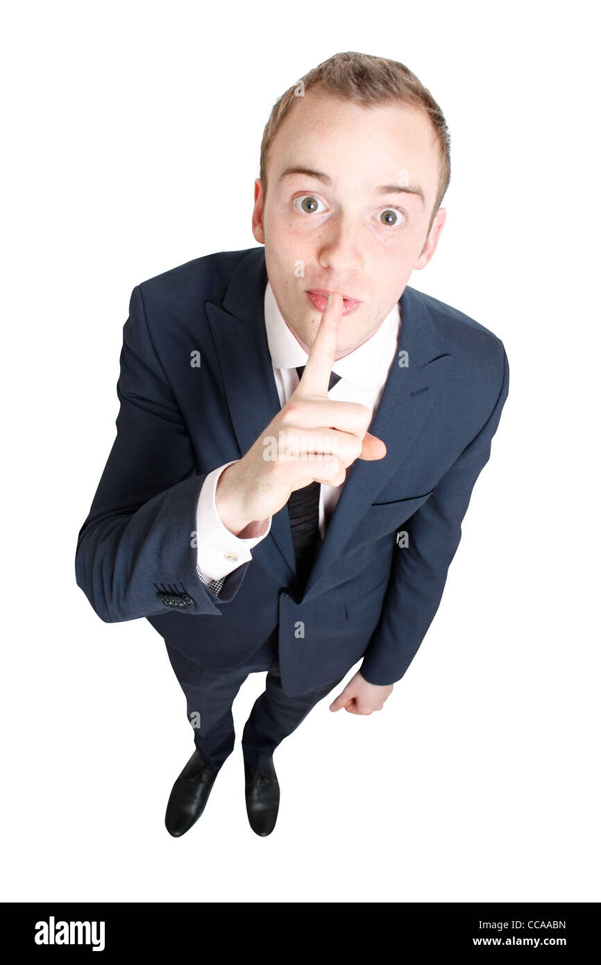 Business man hushing Stock Photo - Alamy