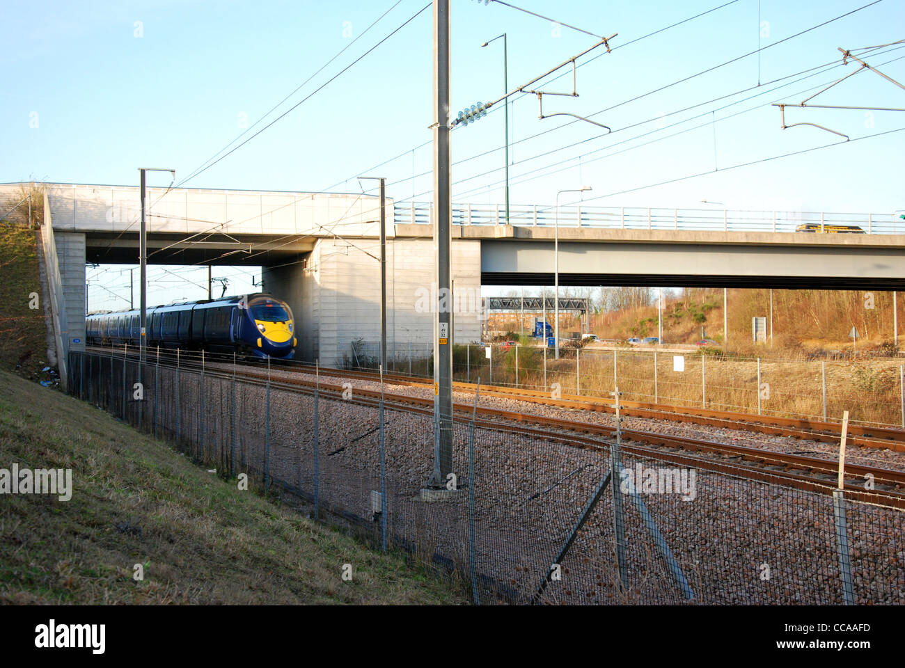 High speed train under a bridge Stock Photo - Alamy