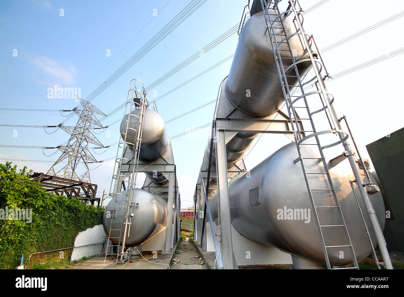 gas container and power tower Stock Photo - Alamy