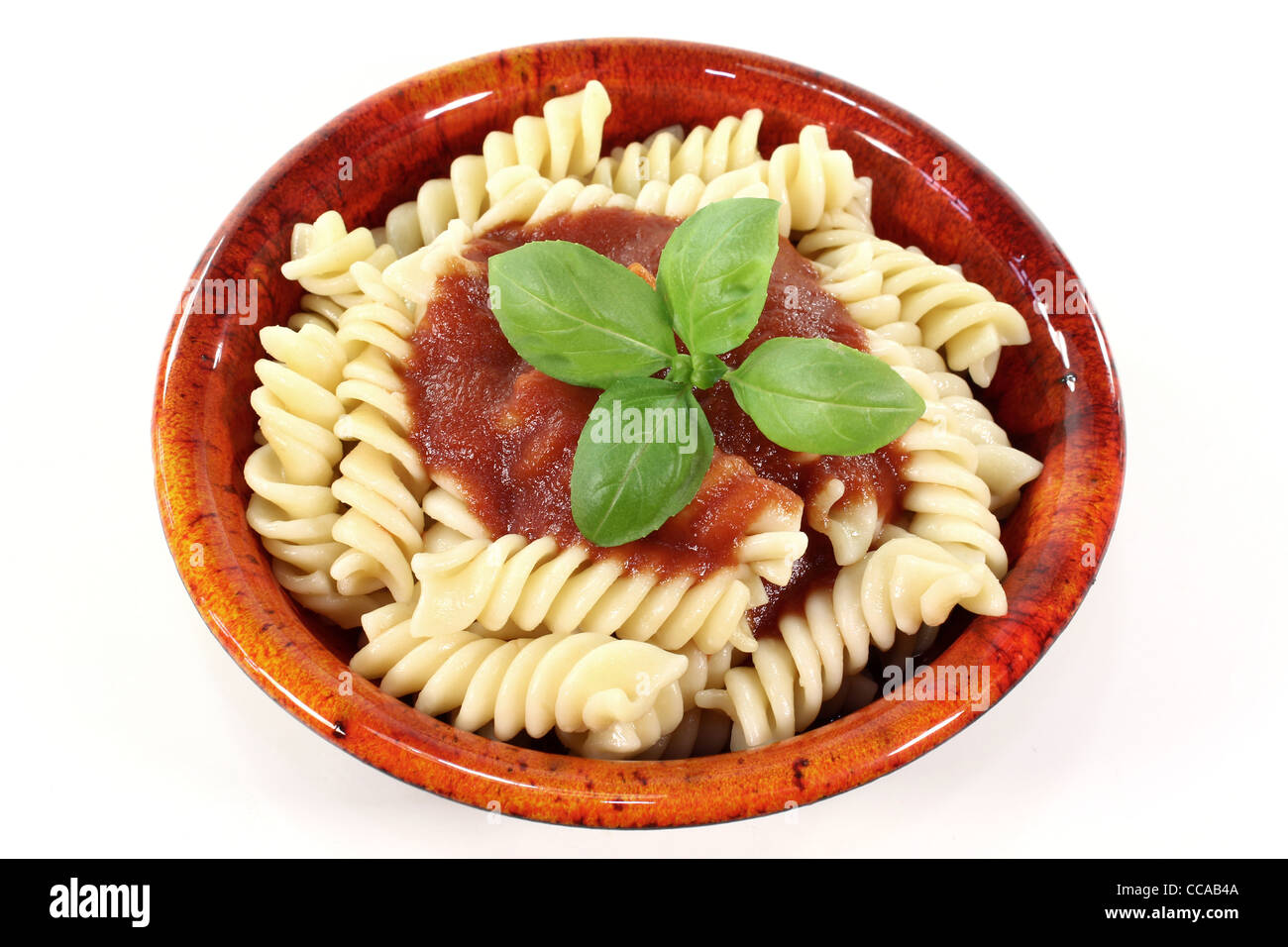 Italian Spirelli with tomato sauce and basil Stock Photo - Alamy