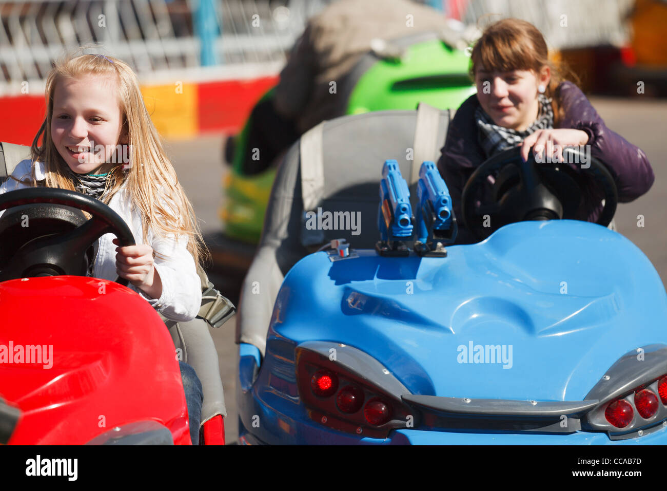 Driving bumper cars hi-res stock photography and images - Alamy