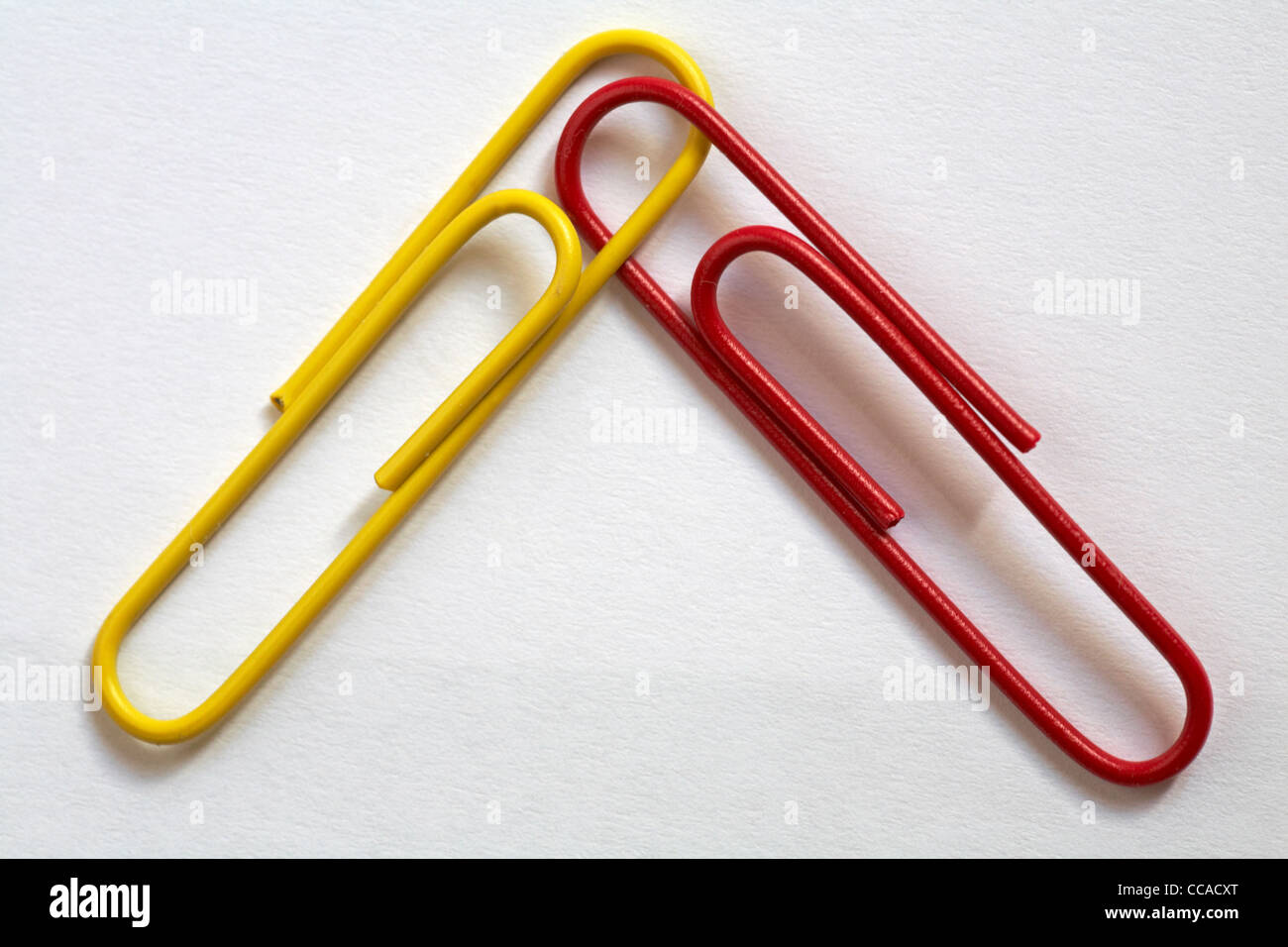 red and yellow paperclip interlinked isolated on white background Stock ...
