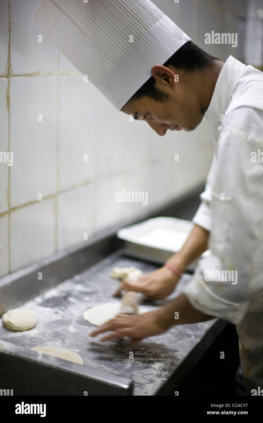 A chef prepares chapati at the Village Restaurant in Siri Fort, New ...