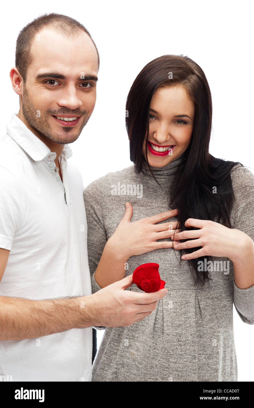 Portrait of handsome young man proposing marriage to a beautiful woman ...