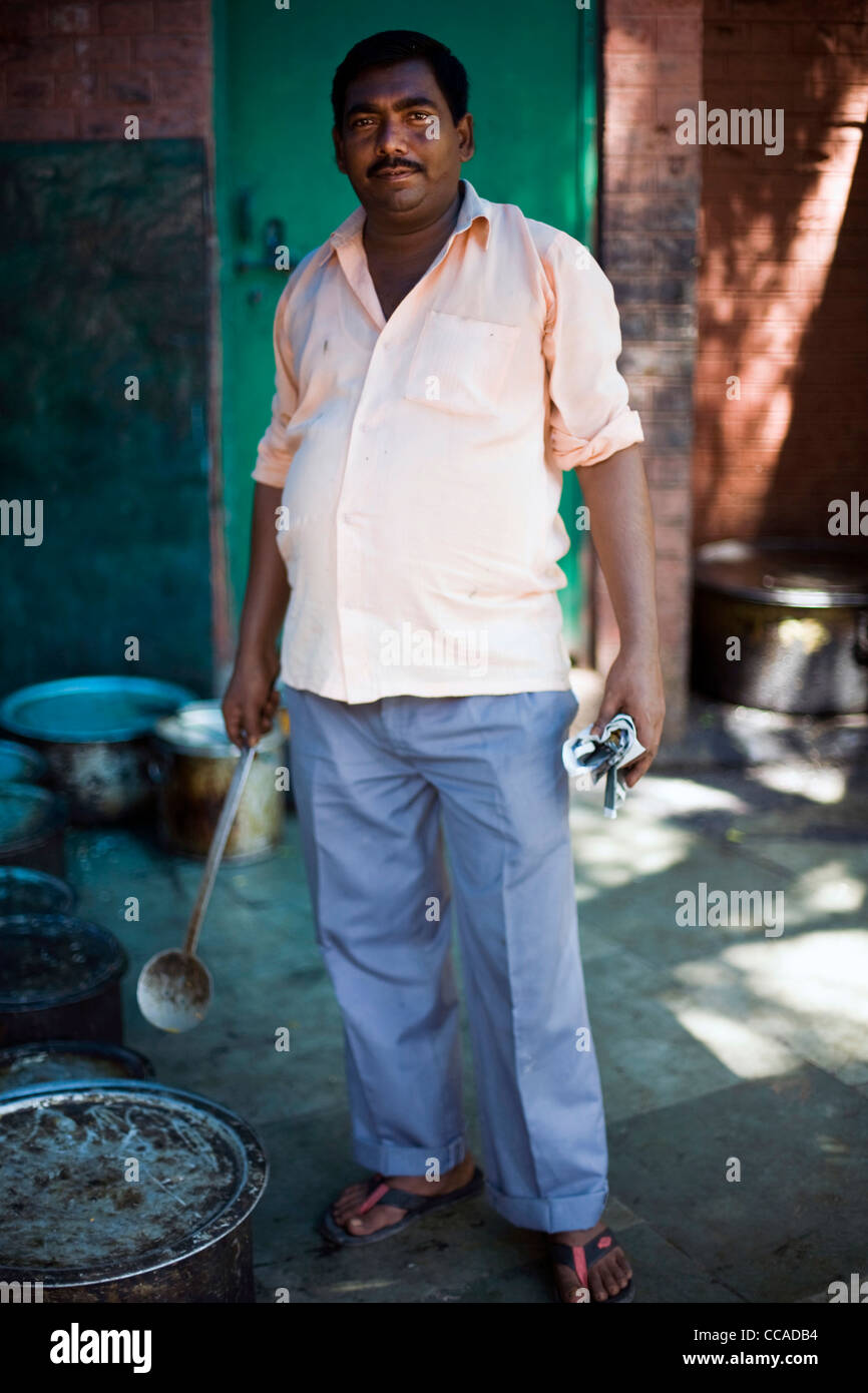 Head chef Mohammed Azad cooks biryani at Babu Shahi Bawarchi, New Delhi ...