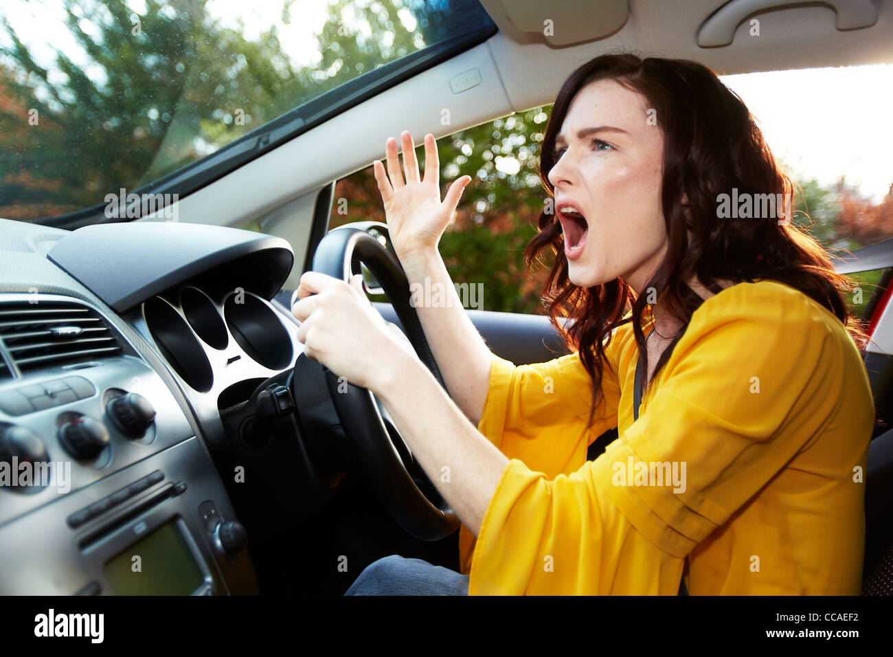 Woman shouting at another driver Stock Photo - Alamy