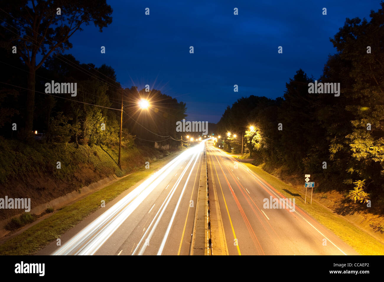 Lights passing cars on road hi-res stock photography and images - Alamy