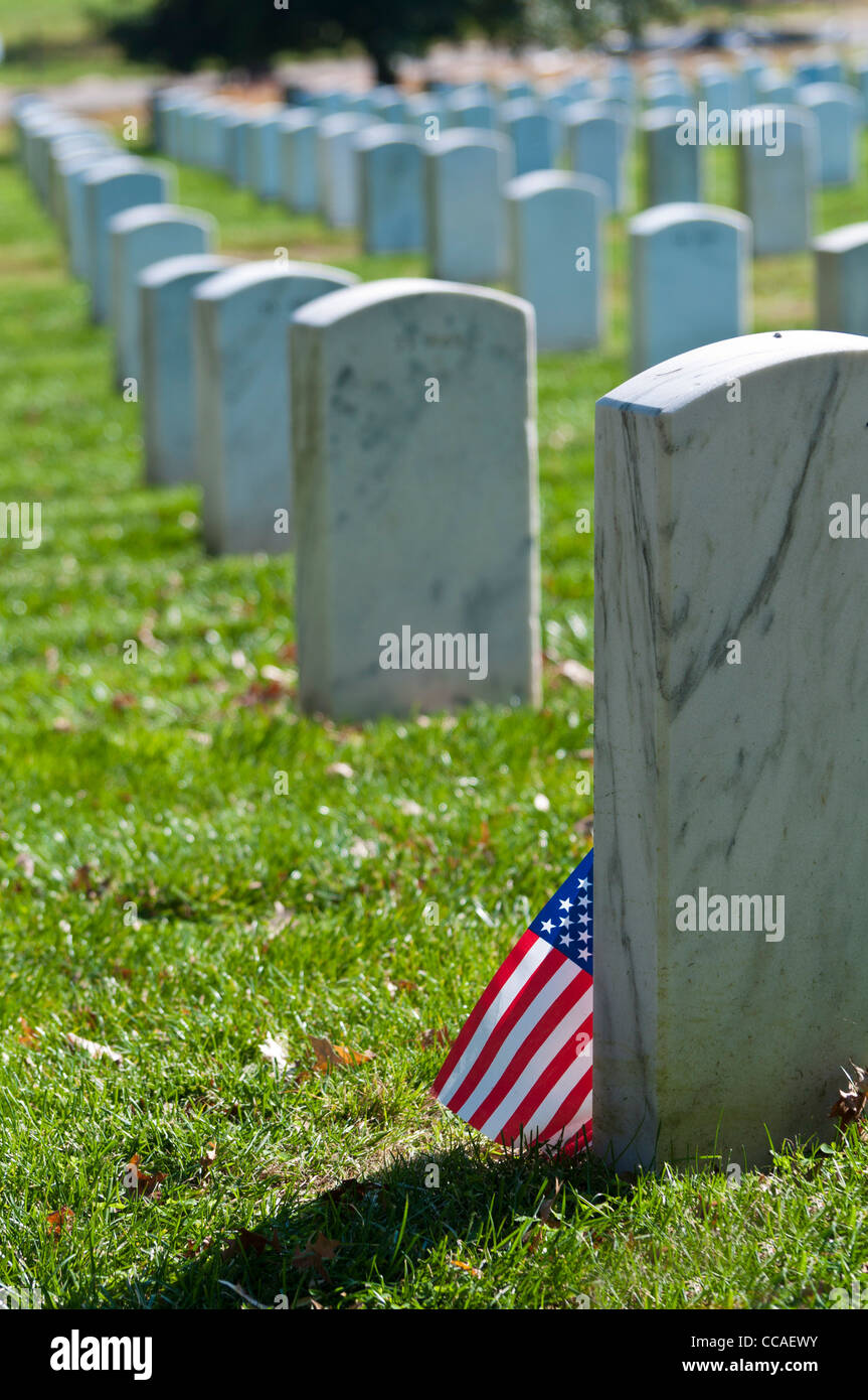 A flag placed by a grave in Arlington Cemetery, Washington DC Stock ...