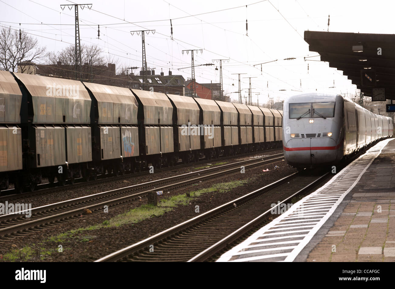 ICE-2 passenger train passing freight train, Cologne, Germany Stock ...