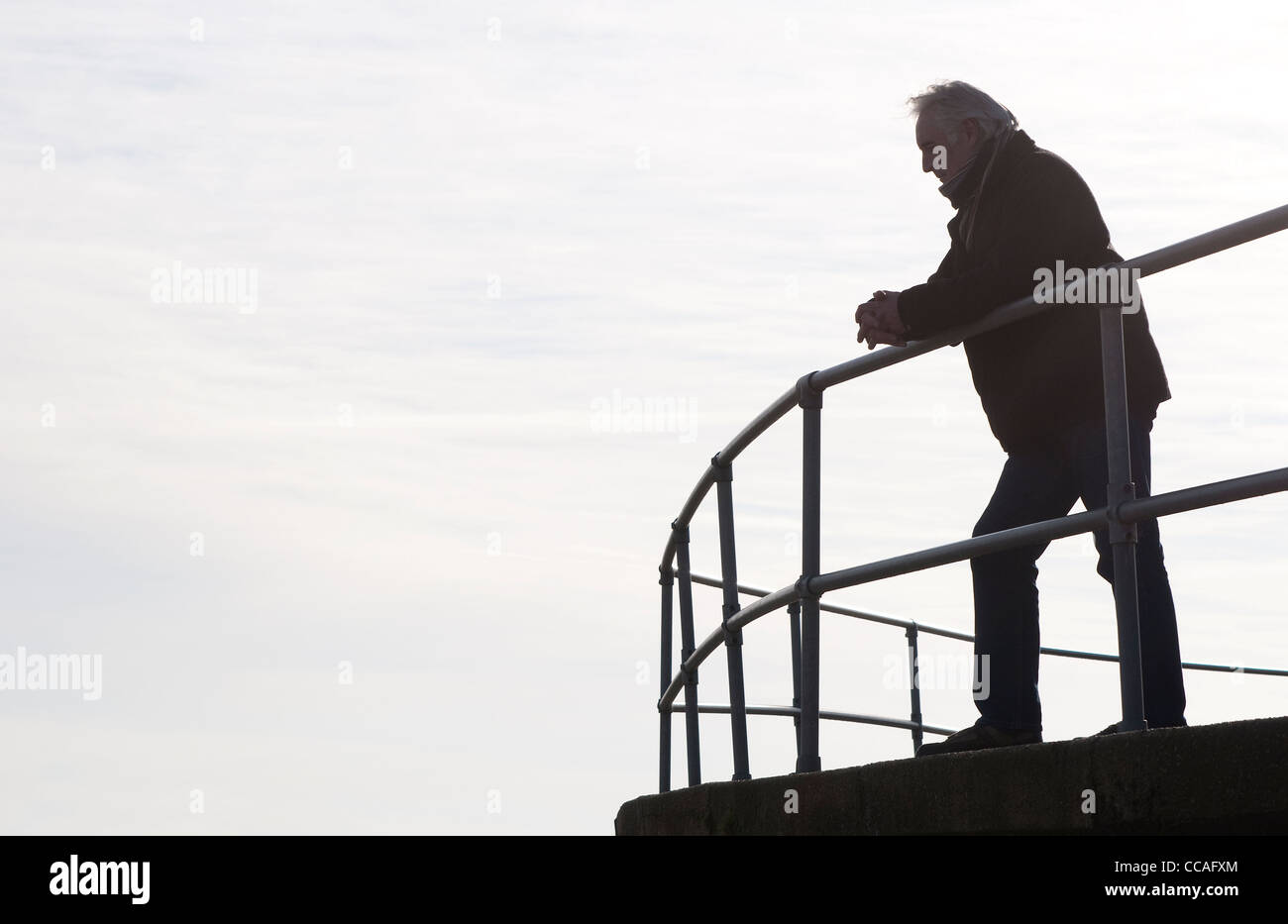 Old man leaning railings hi-res stock photography and images - Alamy
