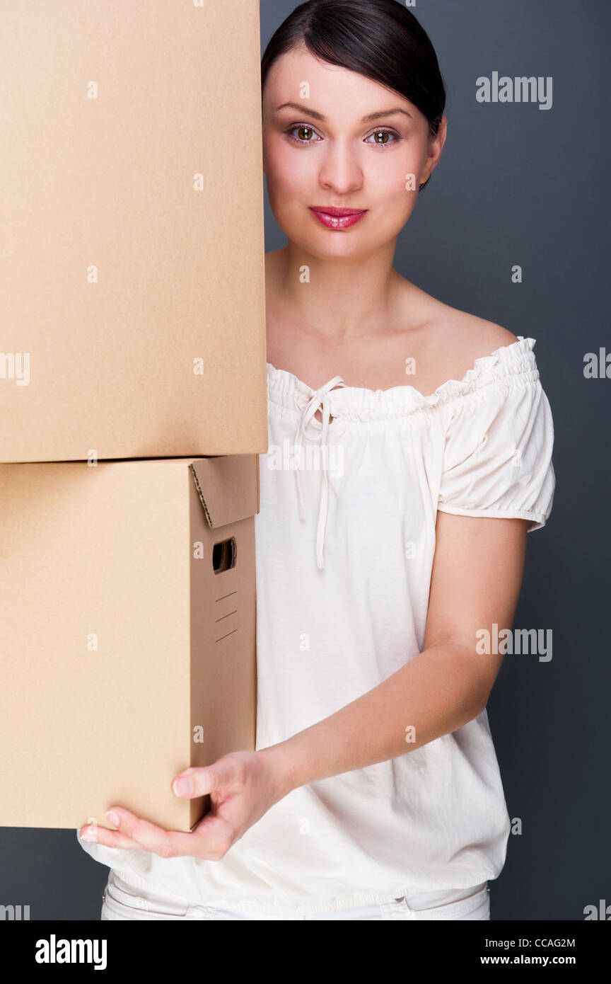 Closeup Portrait of a young woman with boxes Stock Photo - Alamy