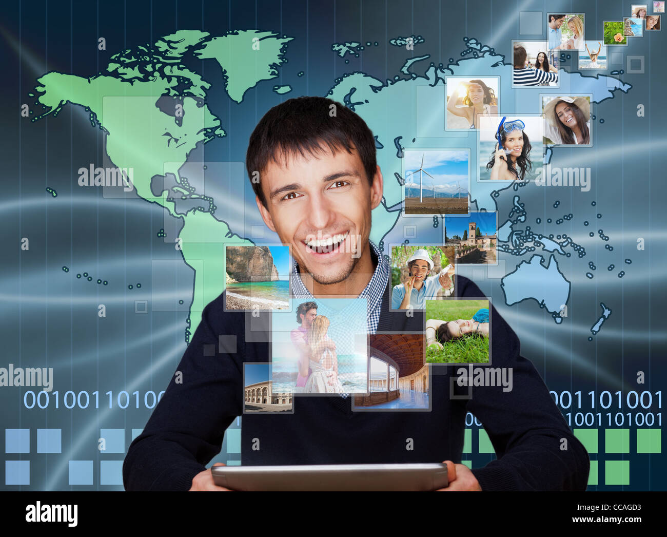 A technology man has images flying away from his modern tablet computer ...