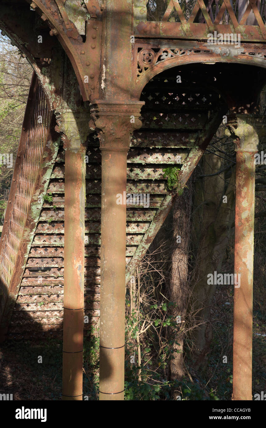 Rusting cast iron footbridge awaiting repairs and restoration to former ...