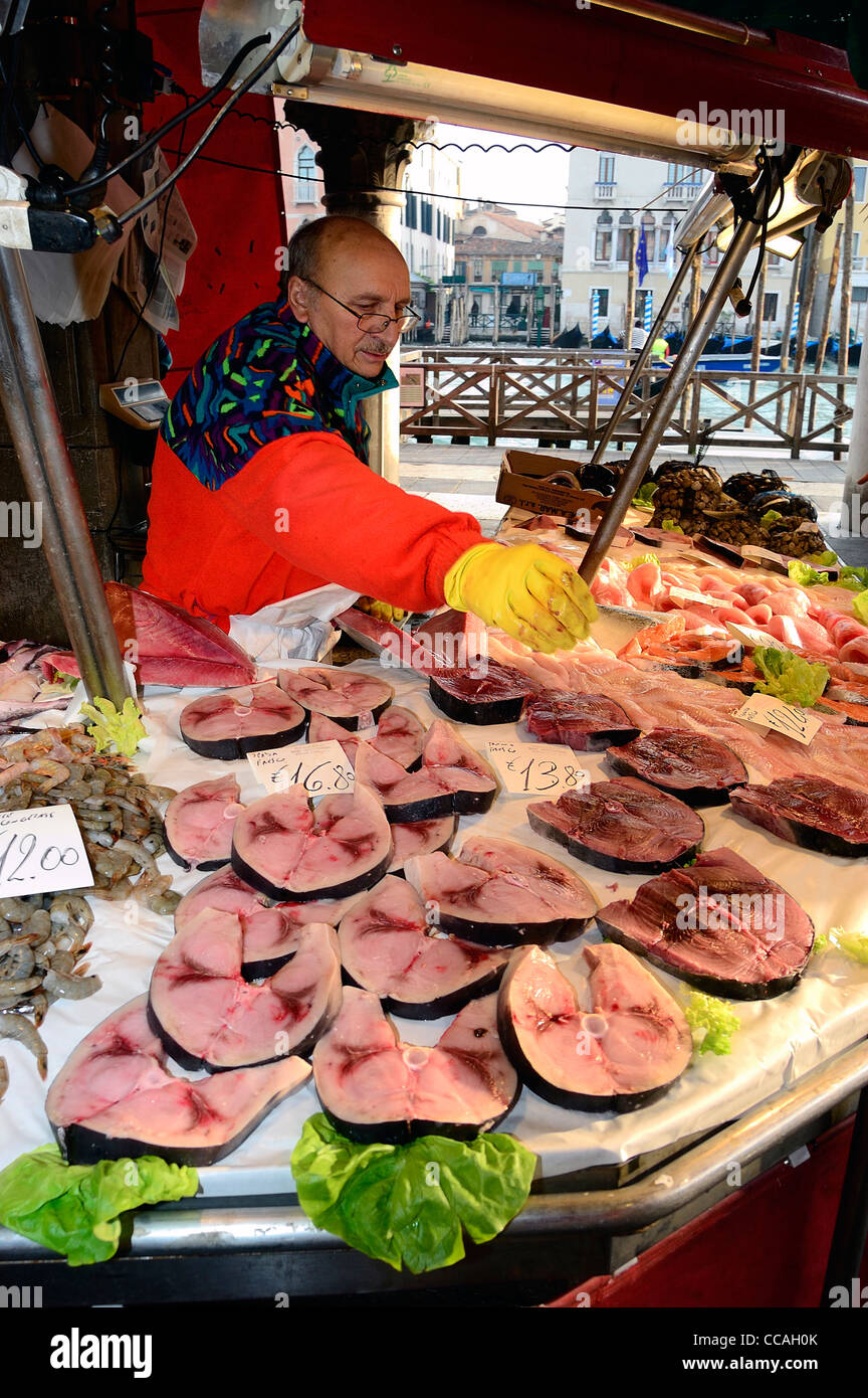 Fishmonger displays his Tuna cuts in the Fish Market on the Grand Canal ...