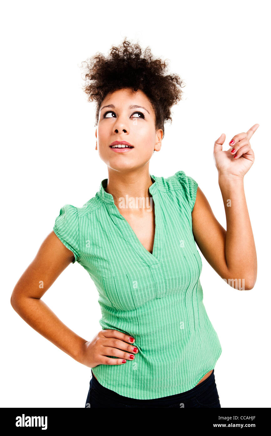 Beautiful woman pointing up. Studio shot with isolated white background ...