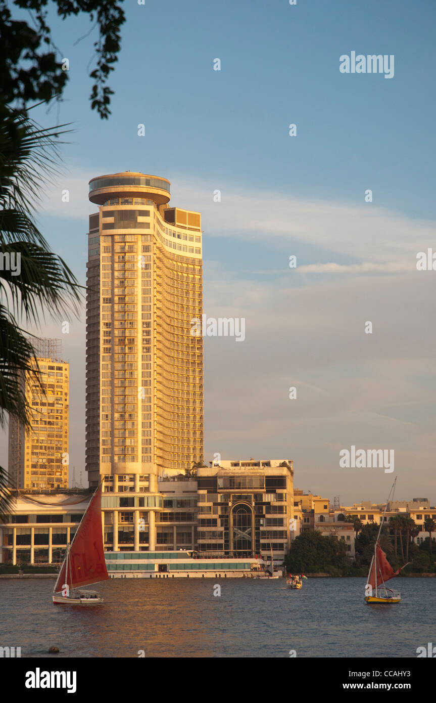 Feluccas passing the Grand Hyatt Hotel on the Nile at Cairo Stock Photo ...
