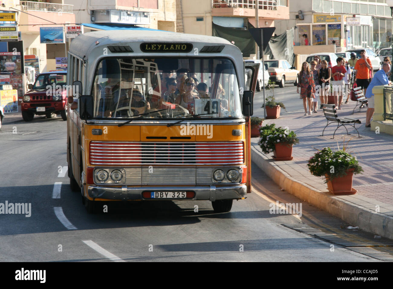 Old Malta bus driving round the Qawra/Bugiba seafront Stock Photo - Alamy