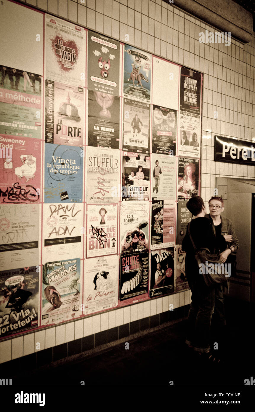 Advertisements posted in a Metro station, Paris, France Stock Photo - Alamy