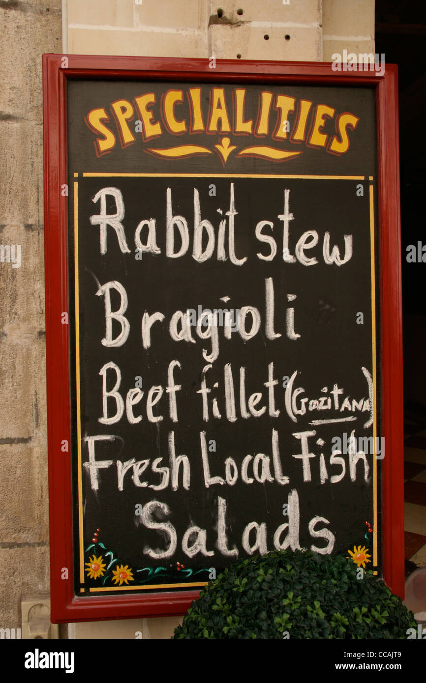 Menu board outside a typical Maltese restaurant in Valletta Stock Photo ...