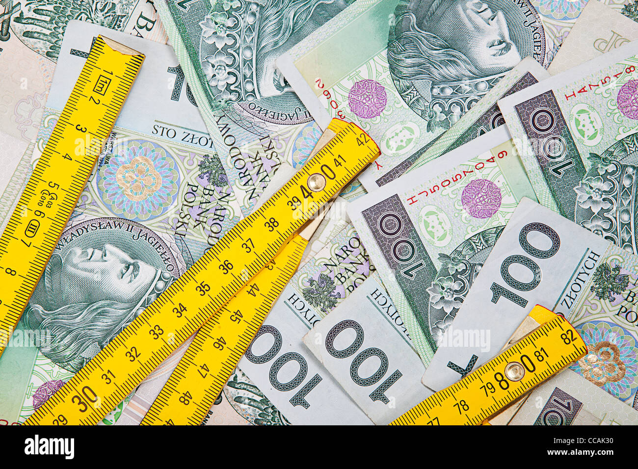 measuring tape on the money background Stock Photo - Alamy