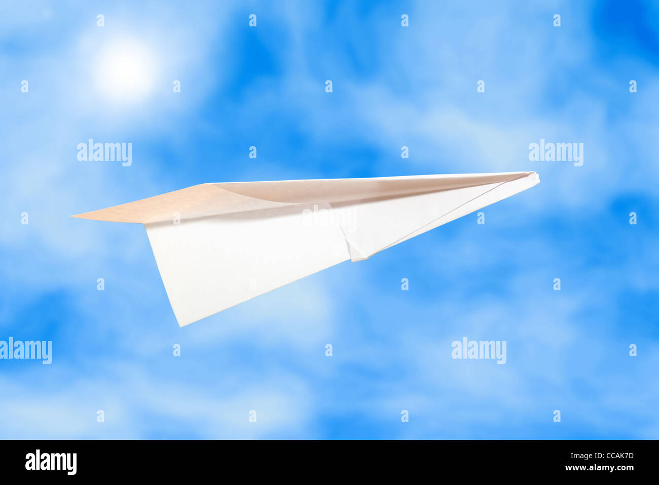 a paper plane fly on sky background Stock Photo - Alamy