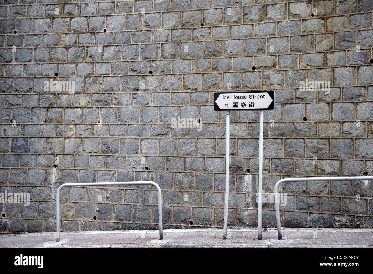 ice house street sign in front of hill retaining battery wall hong kong ...