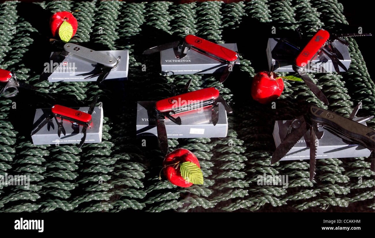 Swiss army pocket knives on display in store window Stock Photo - Alamy