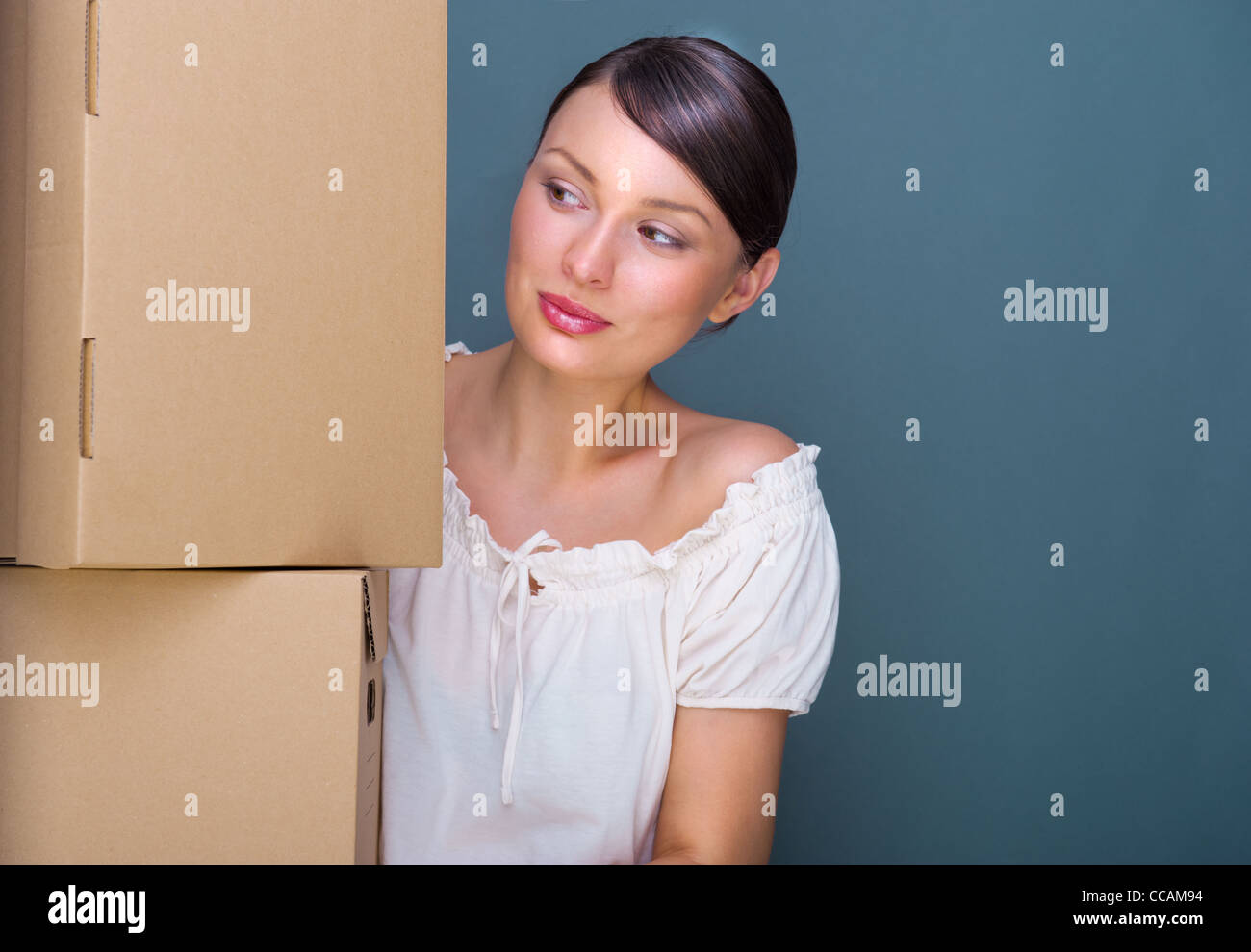 Closeup Portrait of a young woman with boxes Stock Photo - Alamy