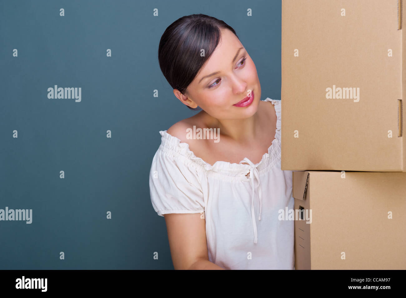 Closeup Portrait of a young woman with boxes Stock Photo - Alamy
