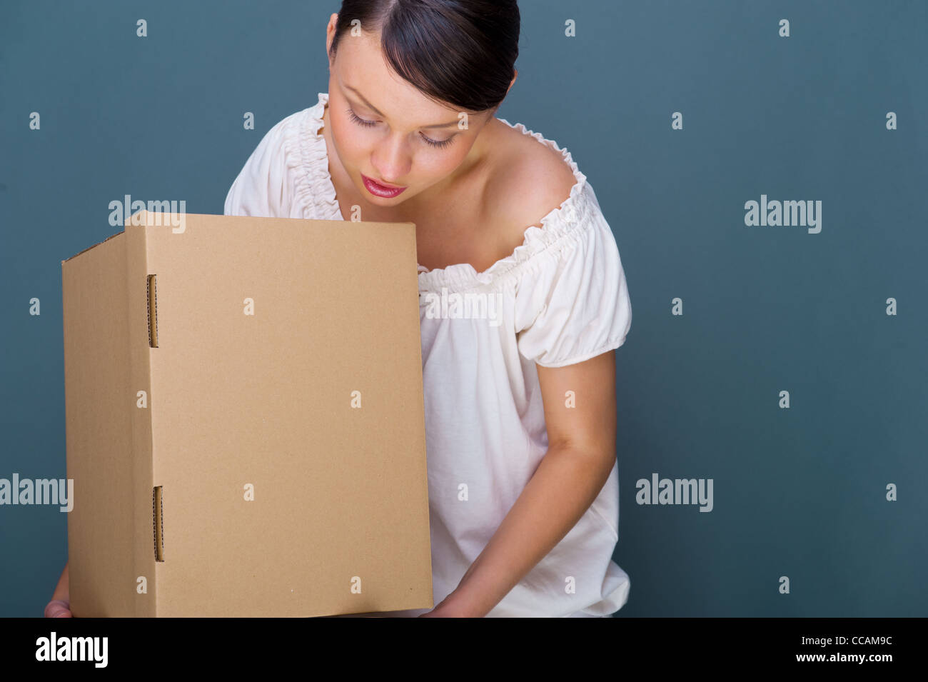 Closeup Portrait of a young woman with boxes Stock Photo - Alamy