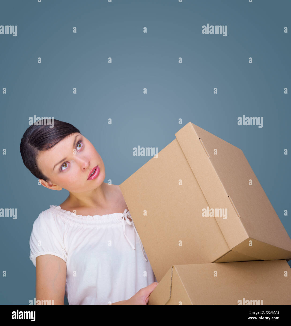 Closeup Portrait of a young woman with boxes Stock Photo - Alamy