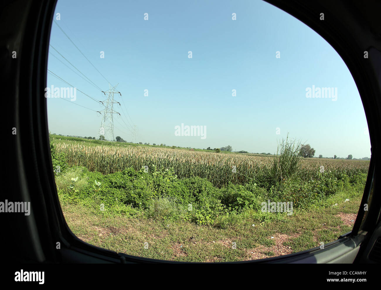 Farms view from car window Stock Photo - Alamy
