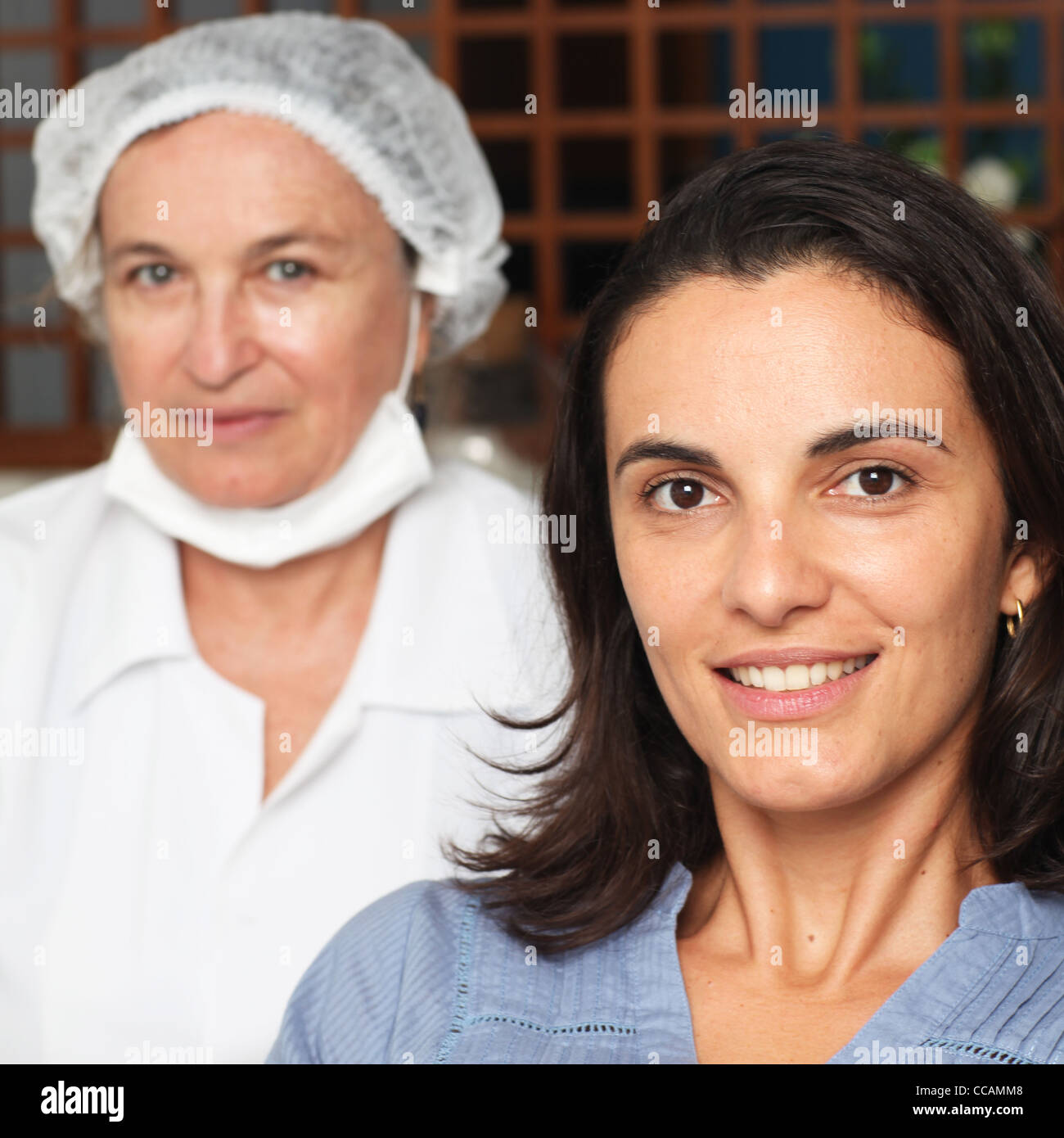 Dentist with Hispanic patient Stock Photo - Alamy