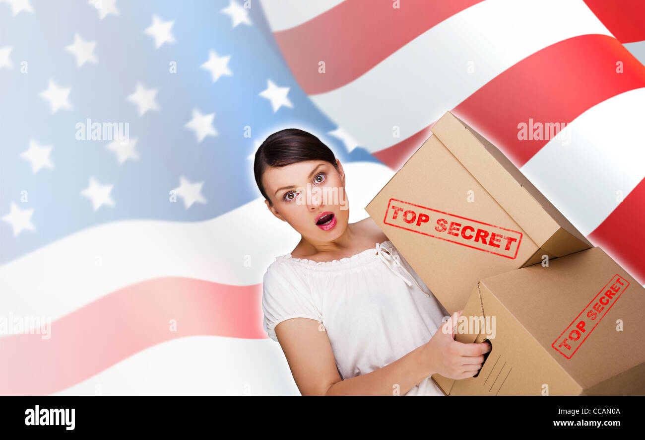 Portrait of young pretty woman with top secret package cardboard box ...