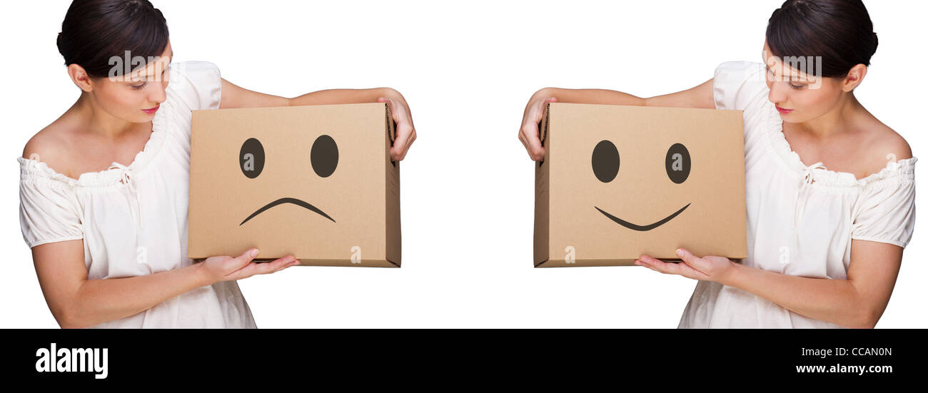 Closeup Portrait of two young women with boxes with two different ...