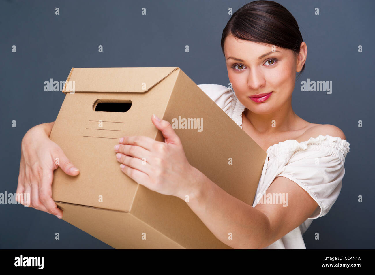 Closeup Portrait of a young woman with boxes Stock Photo - Alamy