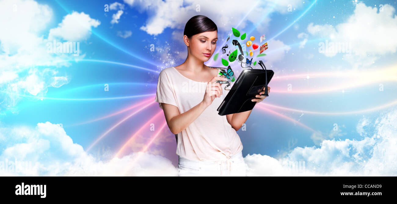 Young pretty woman using her universal device Stock Photo - Alamy