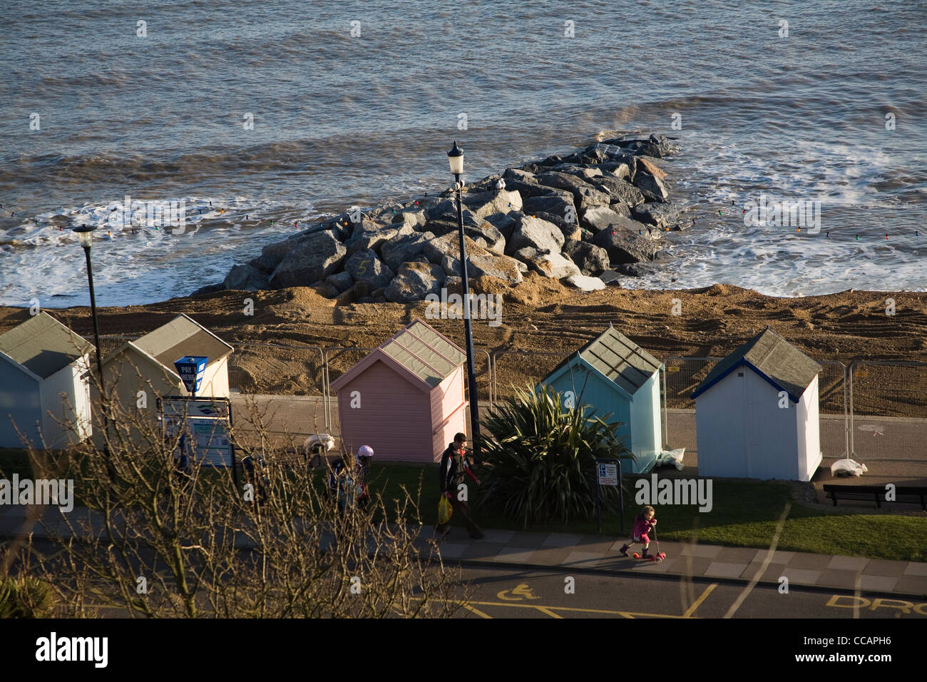 Rock groynes beach huts Felixstowe beach Stock Photo - Alamy
